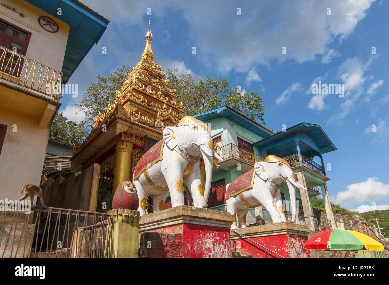Decorated entrance with big white elephant witch lead to the temple on ...