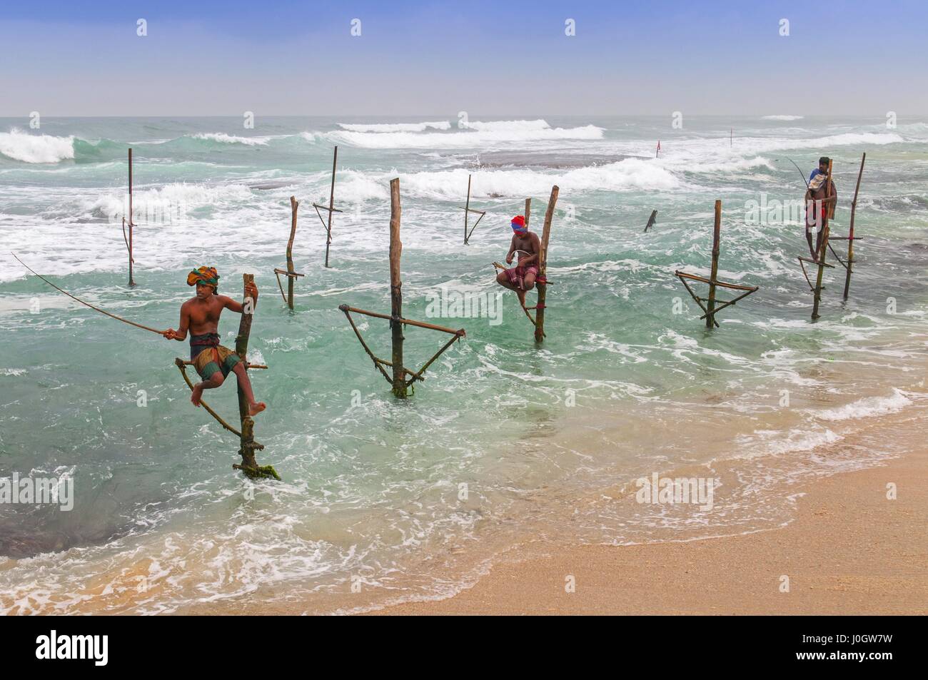 Stilt fishing is fishing in shallow water on a platform made up of a ...