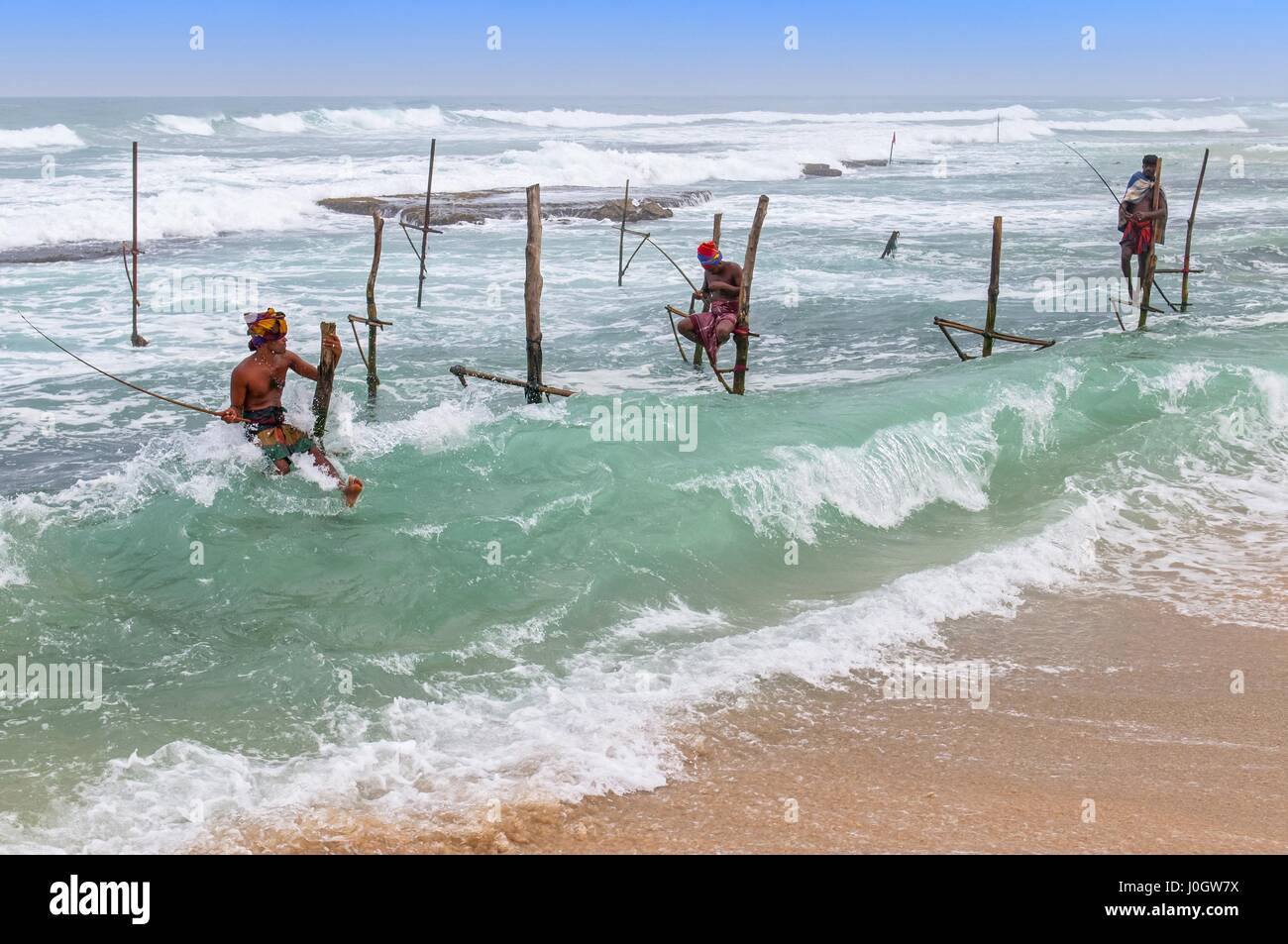 Stilt fishing is fishing in shallow water on a platform made up of a ...