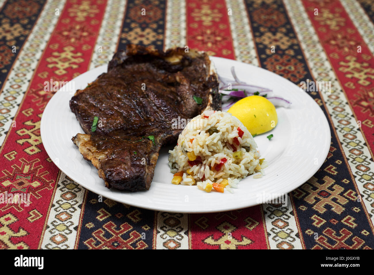 Barbecue veal steak with rice Stock Photo - Alamy