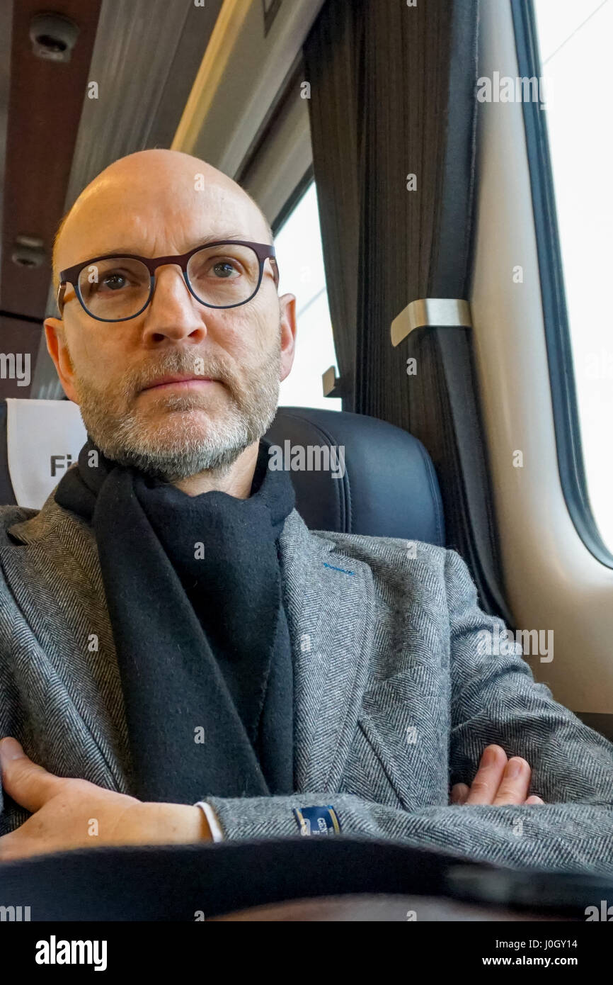 Middle aged male figure wearing glasses Stock Photo - Alamy