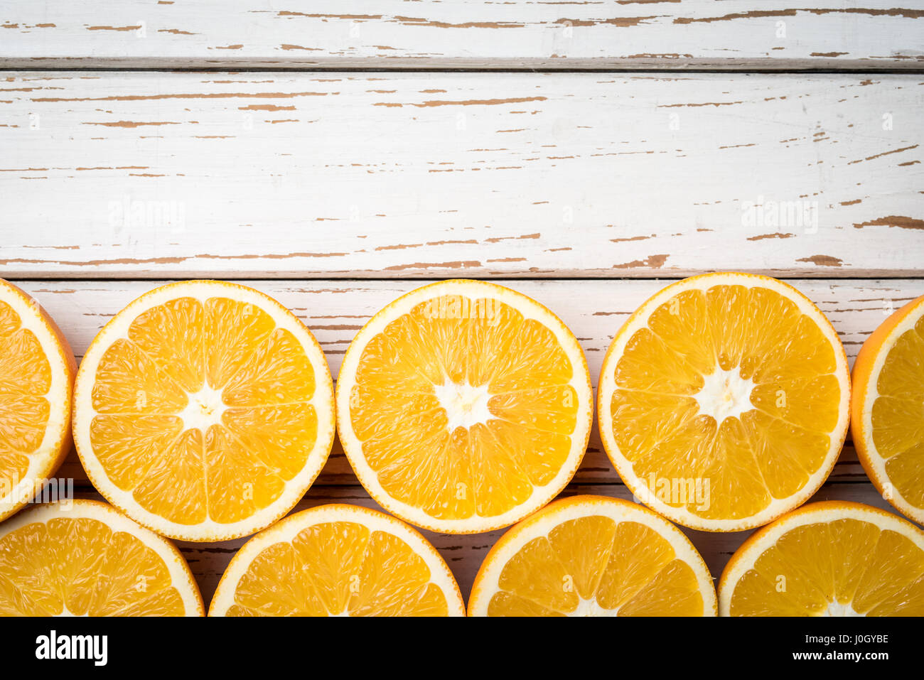 Half cut oranges background Stock Photo - Alamy