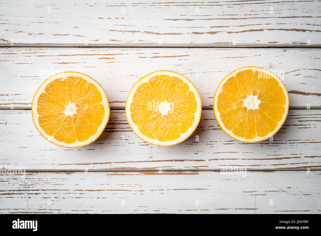 Half cut oranges background Stock Photo - Alamy