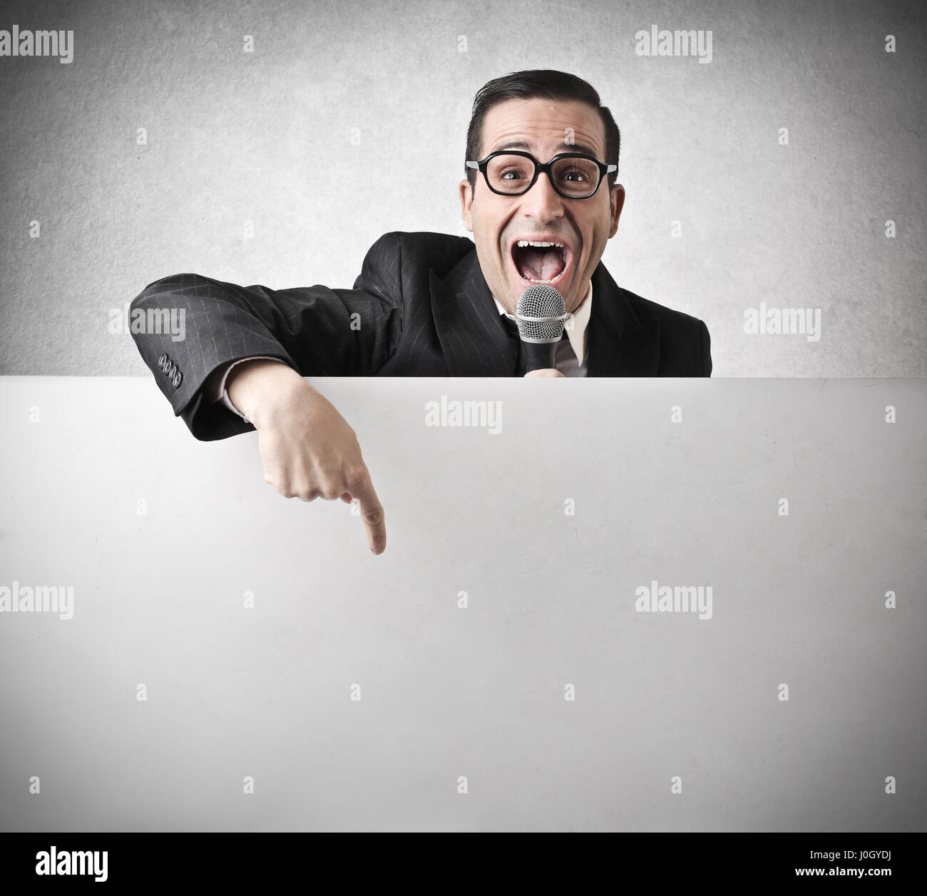 Businessman pointing at empty board Stock Photo - Alamy