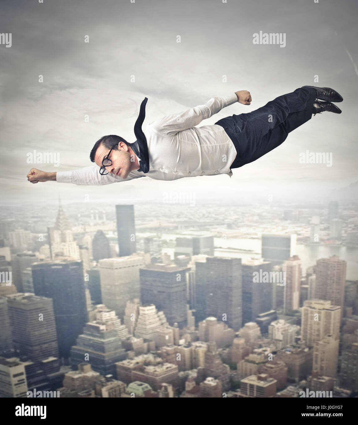 Businessman flying in the sky Stock Photo - Alamy
