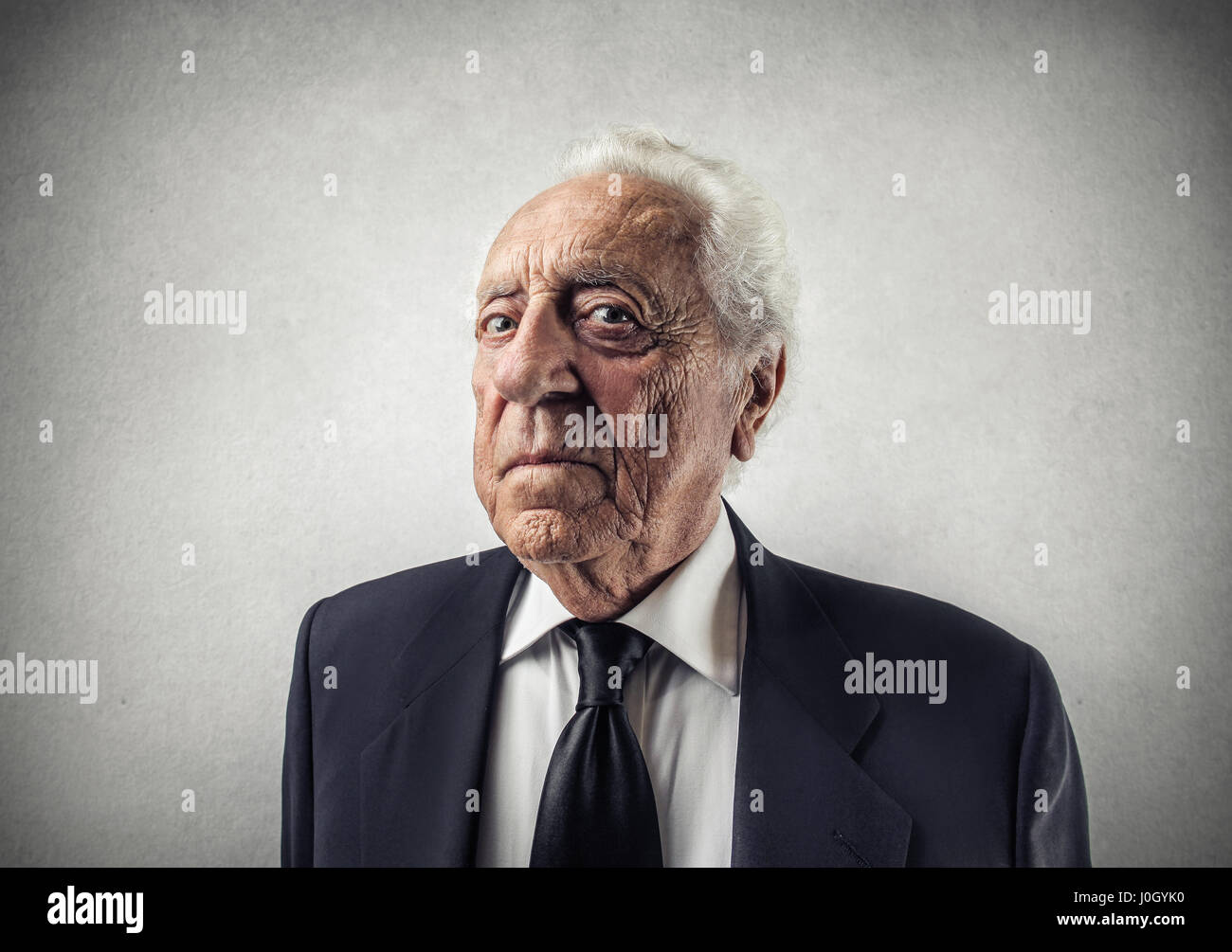 Old businessman's portrait Stock Photo - Alamy