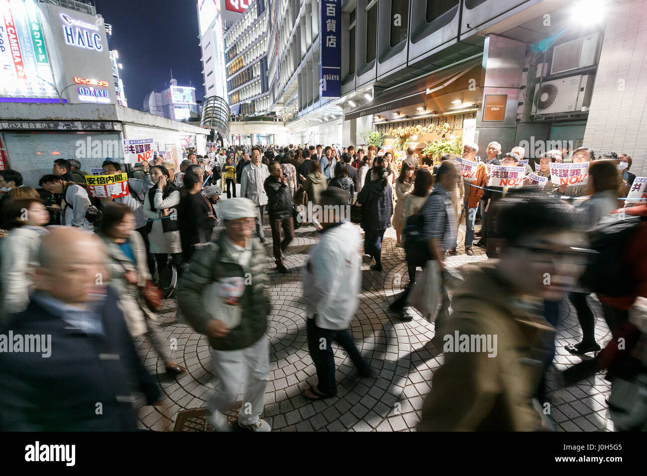Tokyo, Japan. 13th Apr, 2017. Protesters hold placards against Prime ...