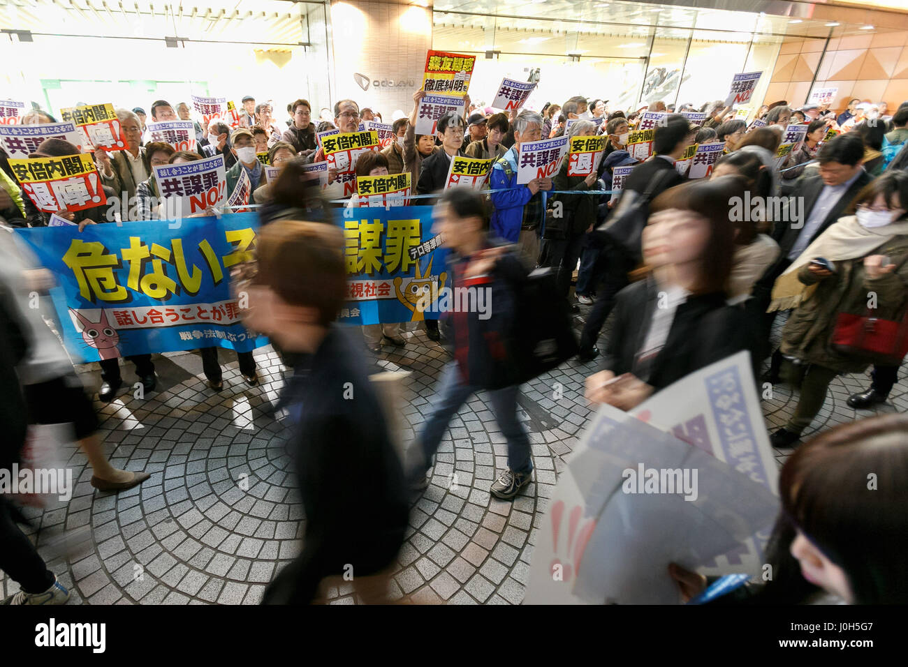 Tokyo, Japan. 13th Apr, 2017. Protesters hold placards against Prime ...