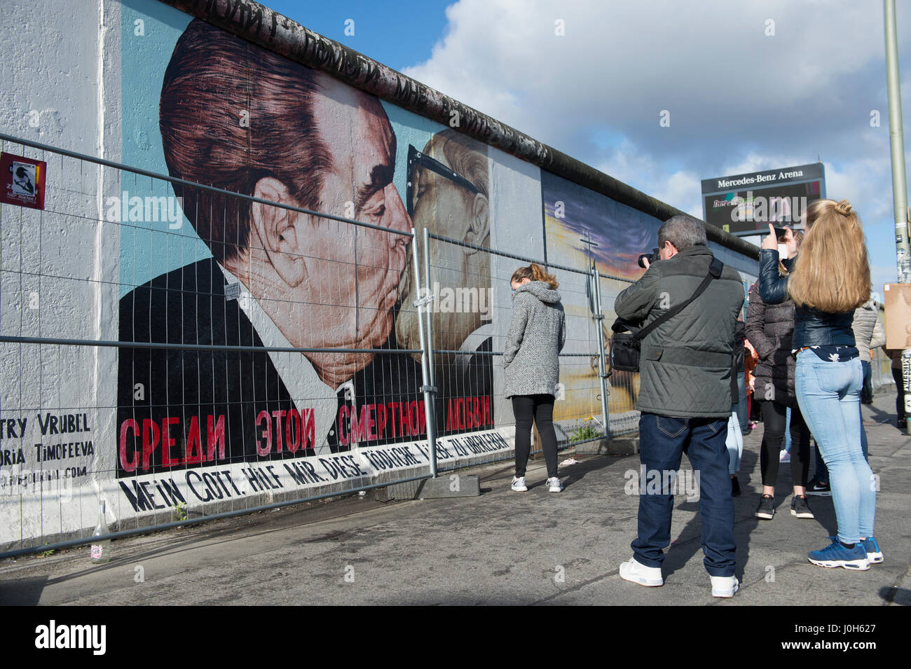 Berlin, Germany. 13th Apr, 2017. Tourists look at a mural entitled 'The ...