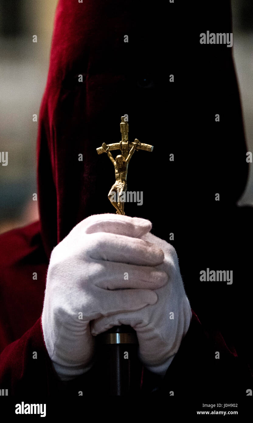 Ovied, Spain. 13th April, 2017. Nazarene with a walking stick with a ...