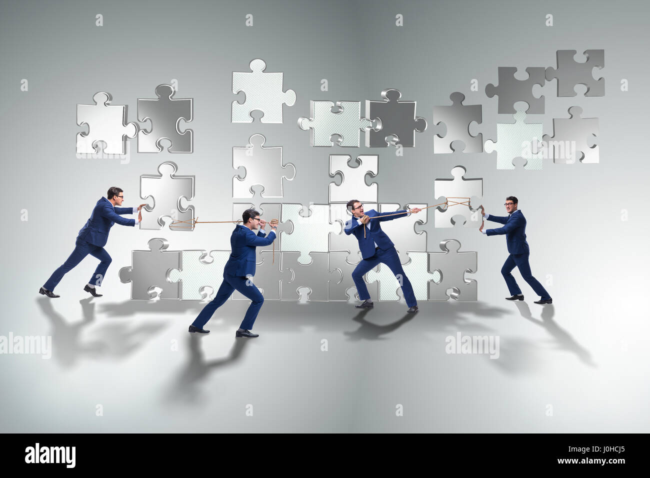Business concept of teamwork with puzzle pieces Stock Photo - Alamy