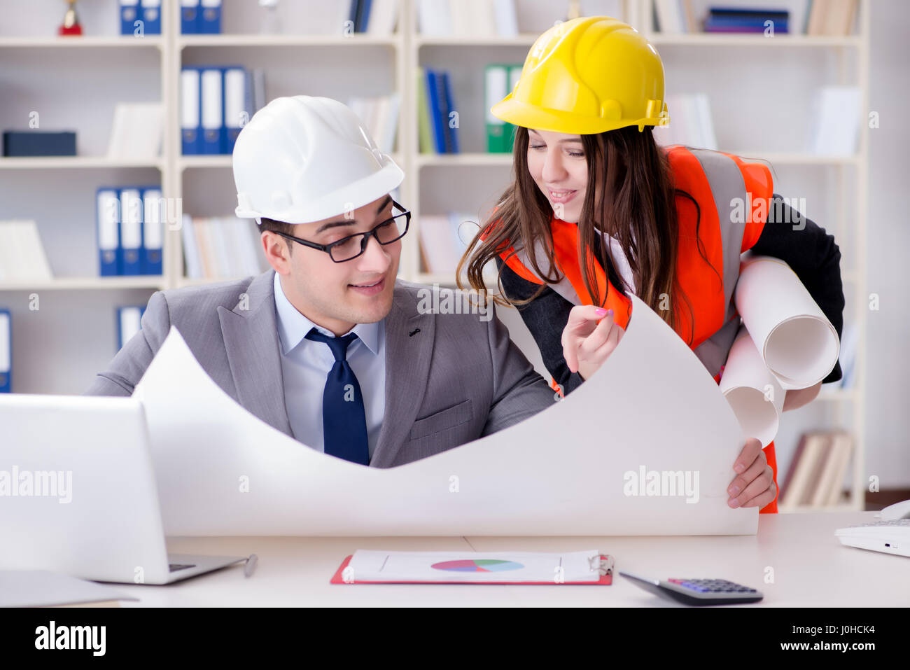 Reviewing architectural drawings hi-res stock photography and images ...