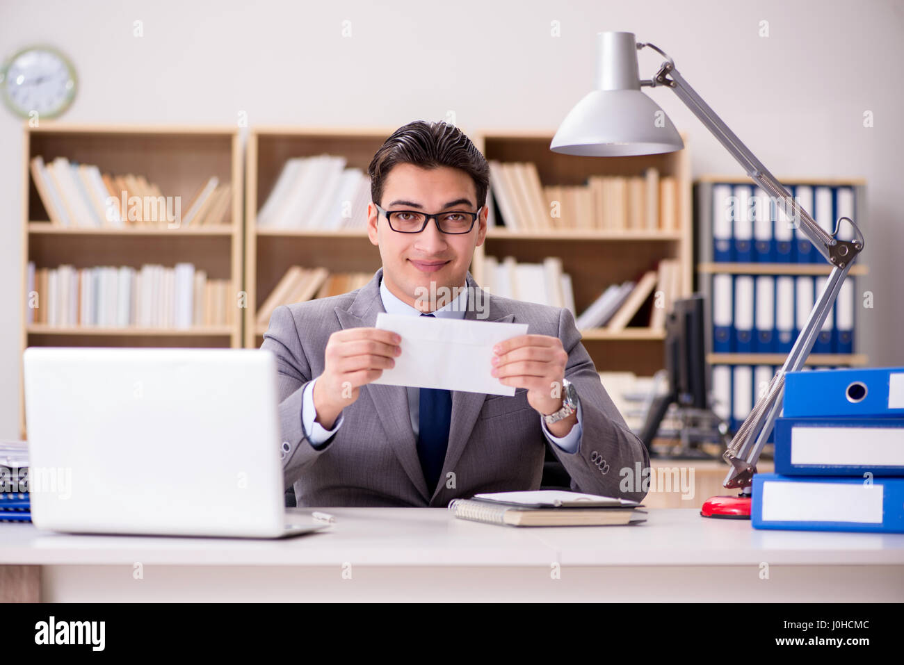 Businessman receiving letter in the office Stock Photo - Alamy