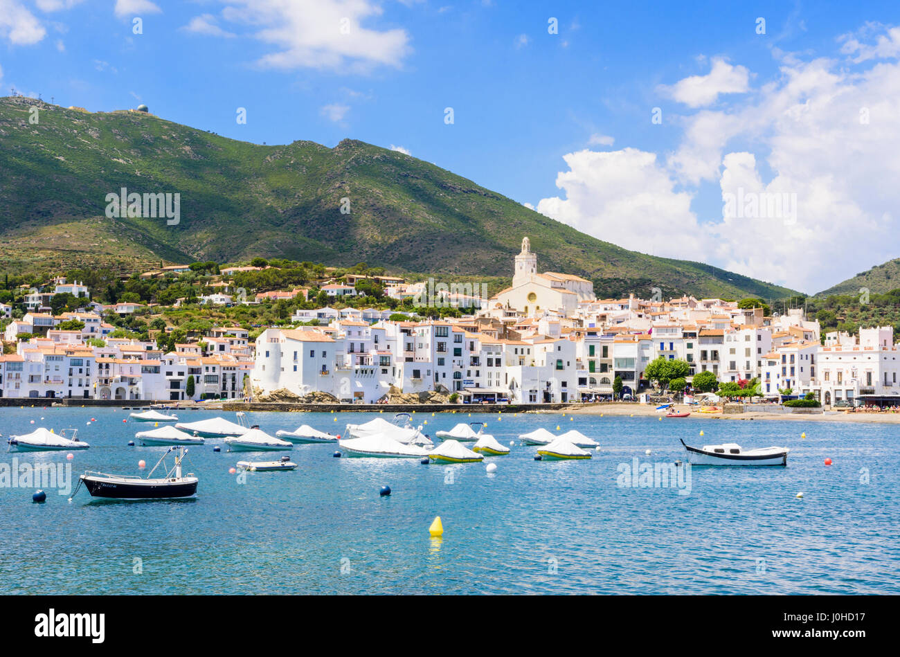 Whitewashed village of Cadaques topped by the Church of Santa Maria ...
