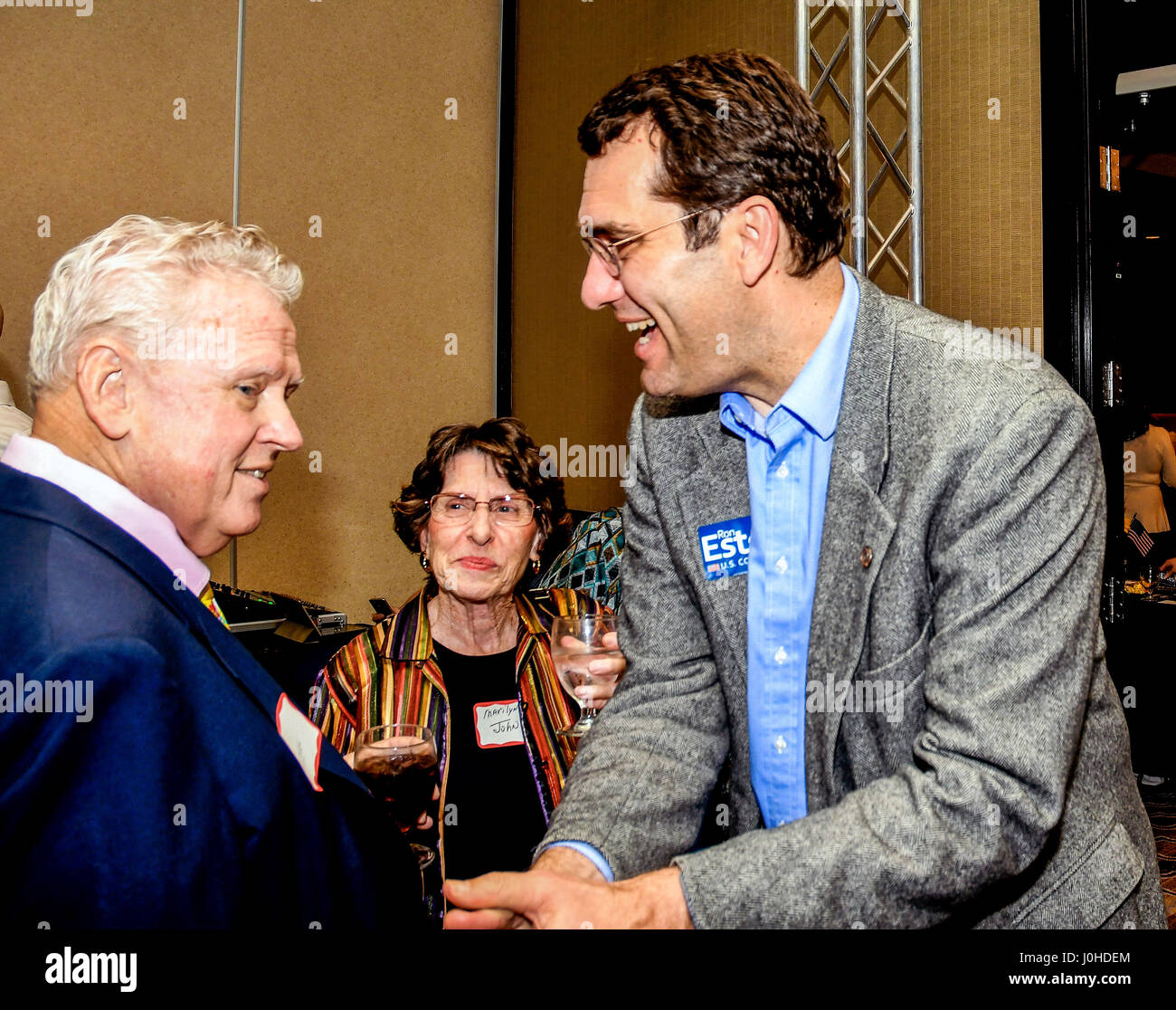 Kansas Attorney General Derek Schmidt shakes hands with a Republican ...
