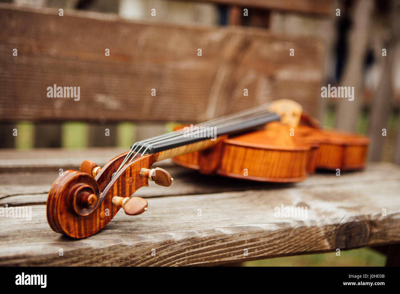 violin closeup with details on rustic background Stock Photo - Alamy
