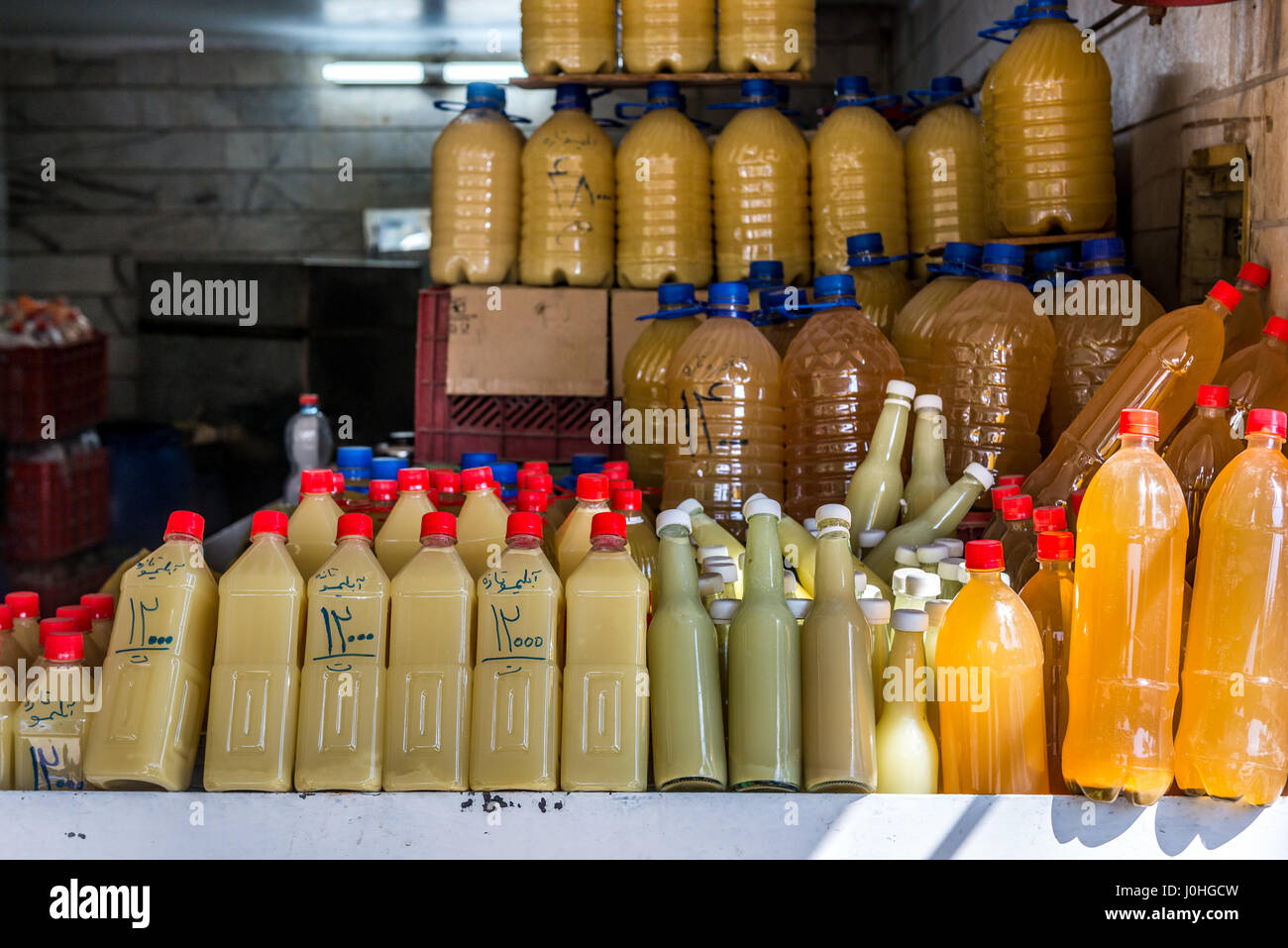 Bottles with squeezed juice in shop in Shiraz city, capital of Fars ...