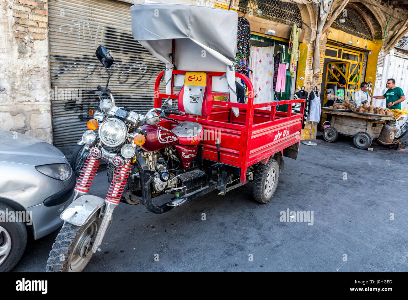 Three-wheeled motorbike with luggage carrier in Shiraz city, capital of ...