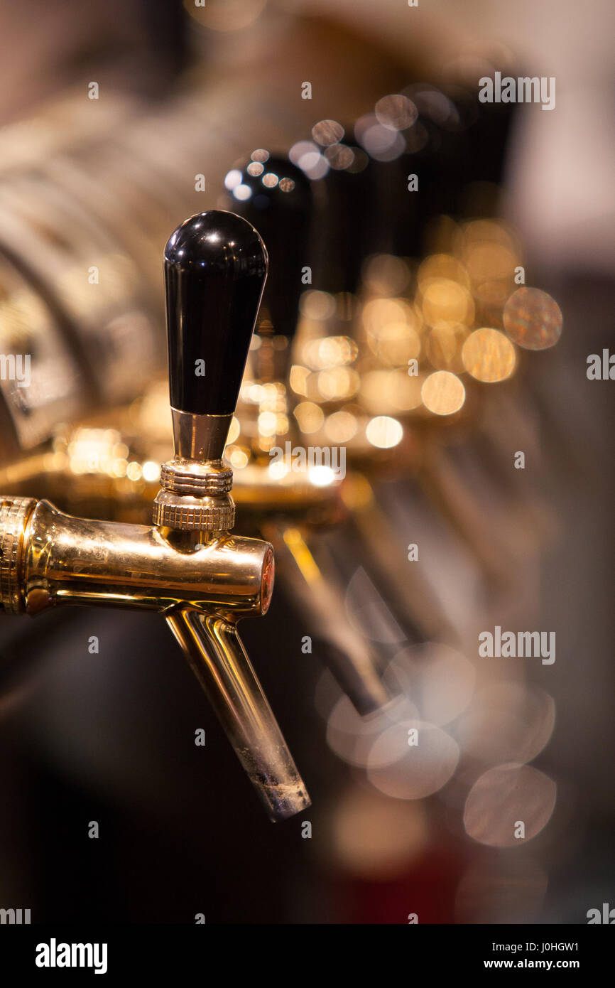 Lot of vintage Golden beer taps at the bar Stock Photo - Alamy