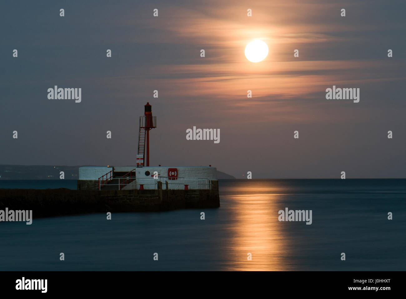 April's Full Moon known as a pink moon rising over Banjo Pier Looe ...