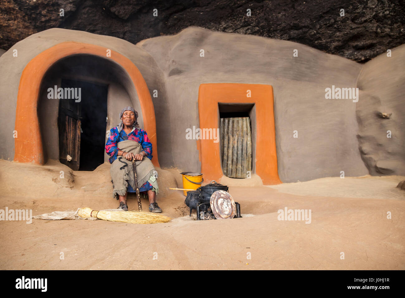 BEREA, LESOTHO - AUGUST 23, 2012: Indigenous woman in front of cave ...