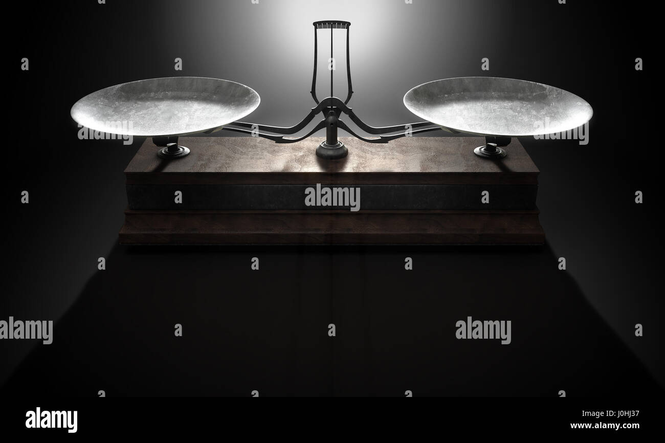 A closeup of empty old metal and wood two pan balance scale on a ...