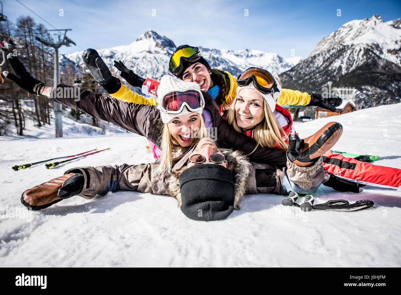 Group of friends having fun on the snow Stock Photo - Alamy