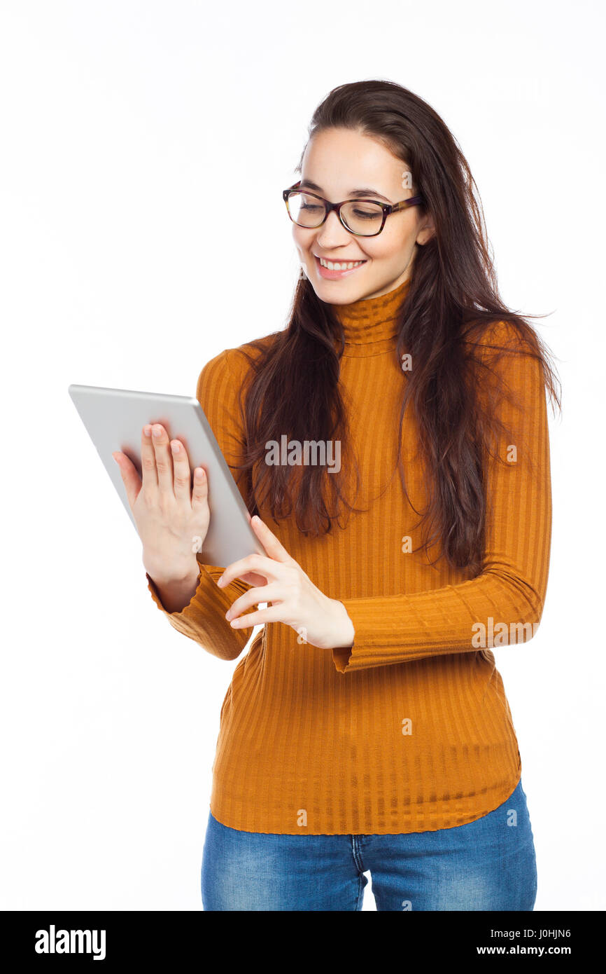 Young woman reading something on an electronic tablet, isolated on ...