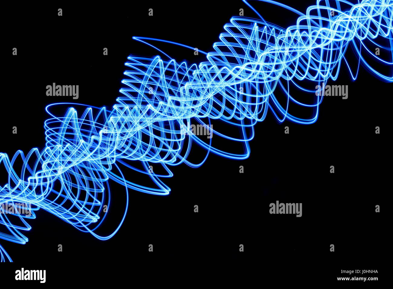 Blue light painting photography, sound waves effect, against a black ...