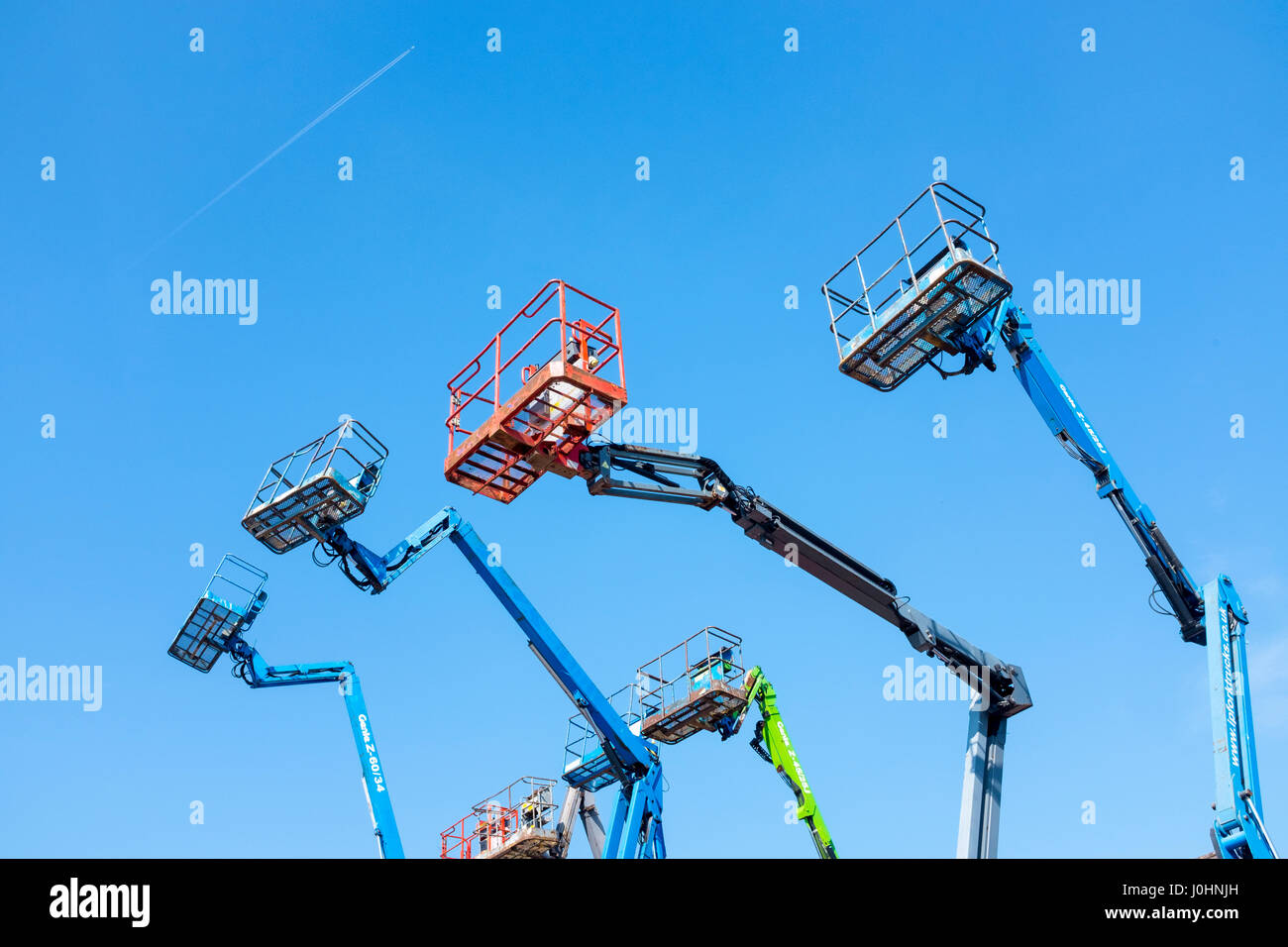 Blue cherry picker hi-res stock photography and images - Alamy