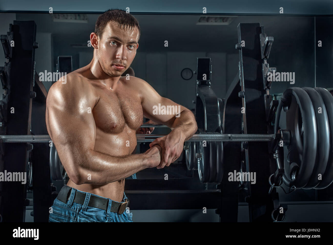 Bodybuilder with a barbell Stock Photo - Alamy