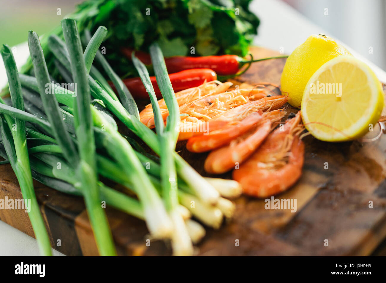 Fresh Prawns, Spring Onion, Lemons and Chillis Stock Photo - Alamy