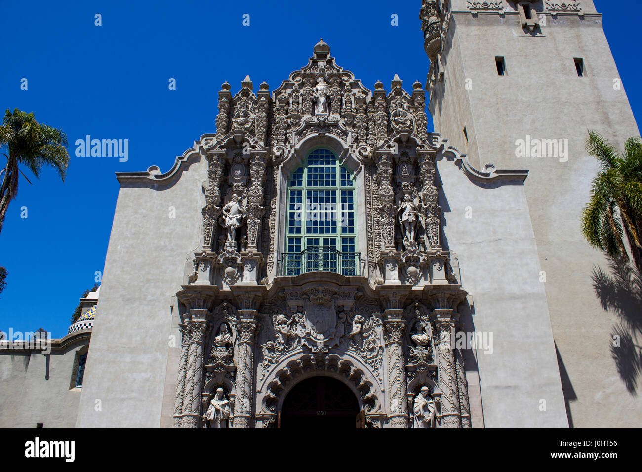 Front of artistic building with tower Stock Photo - Alamy