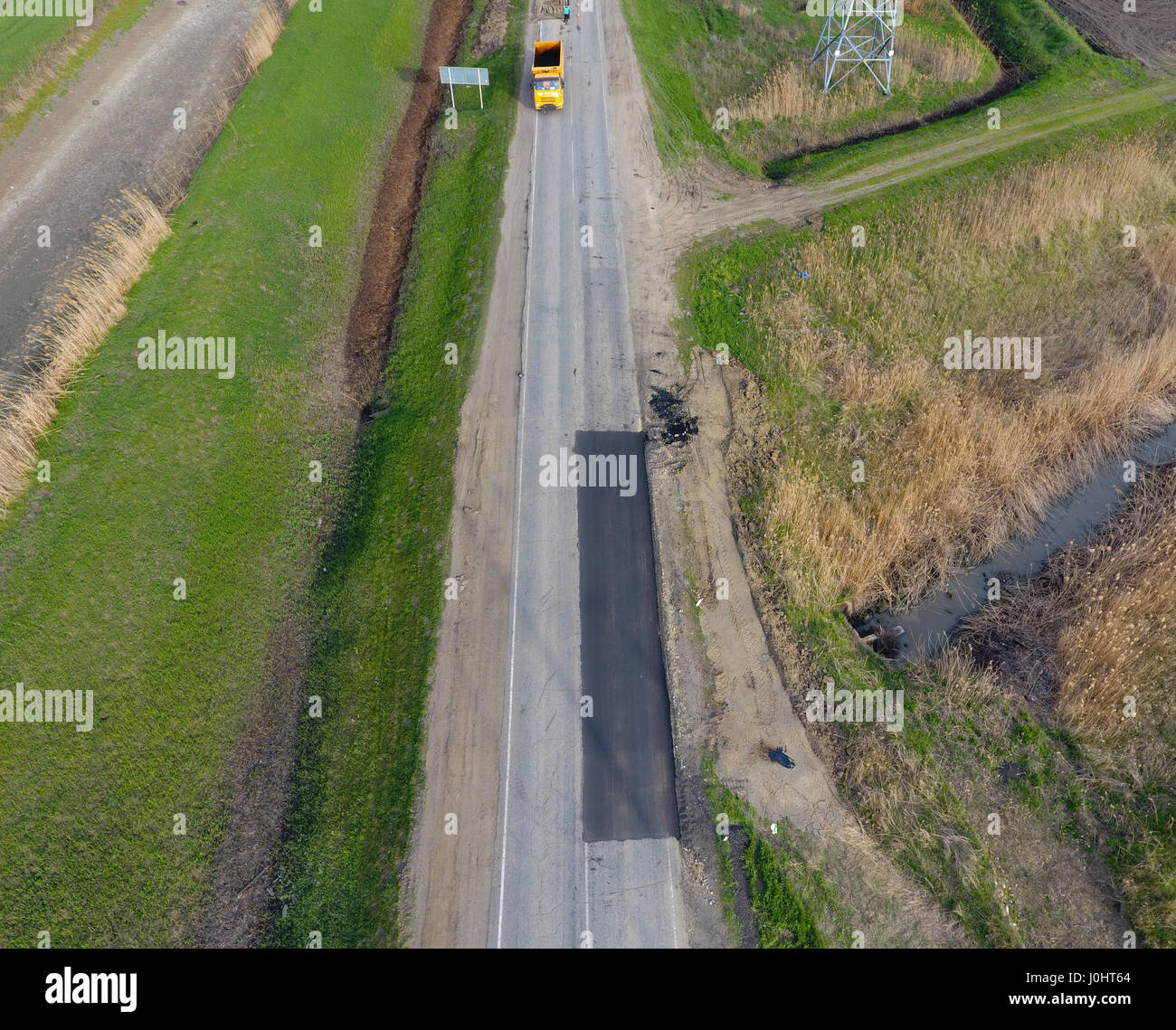 Top view of the road repair. Technics for repair of asphalt ...