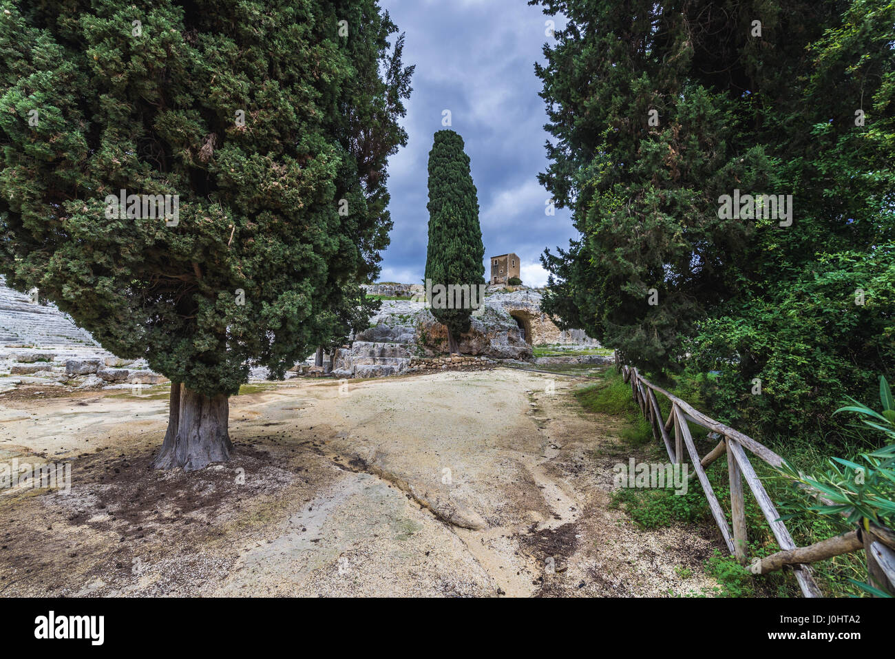 Alley next to ancient ruins of Greek Theater from 5th century BC in ...
