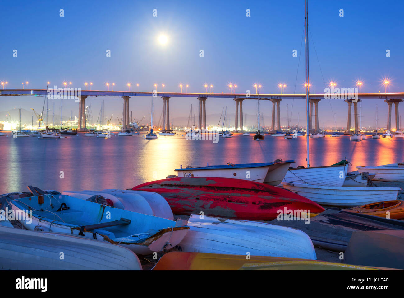 The Moon rising over the Coronado Bridge and San Diego Harbor at night ...