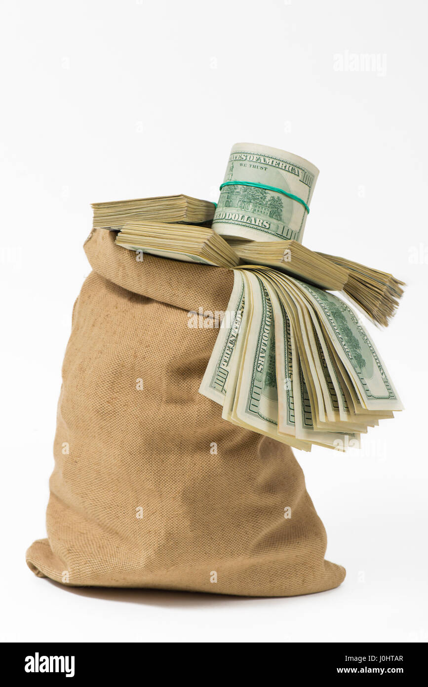 Money in the bag isolated on a white background Stock Photo - Alamy