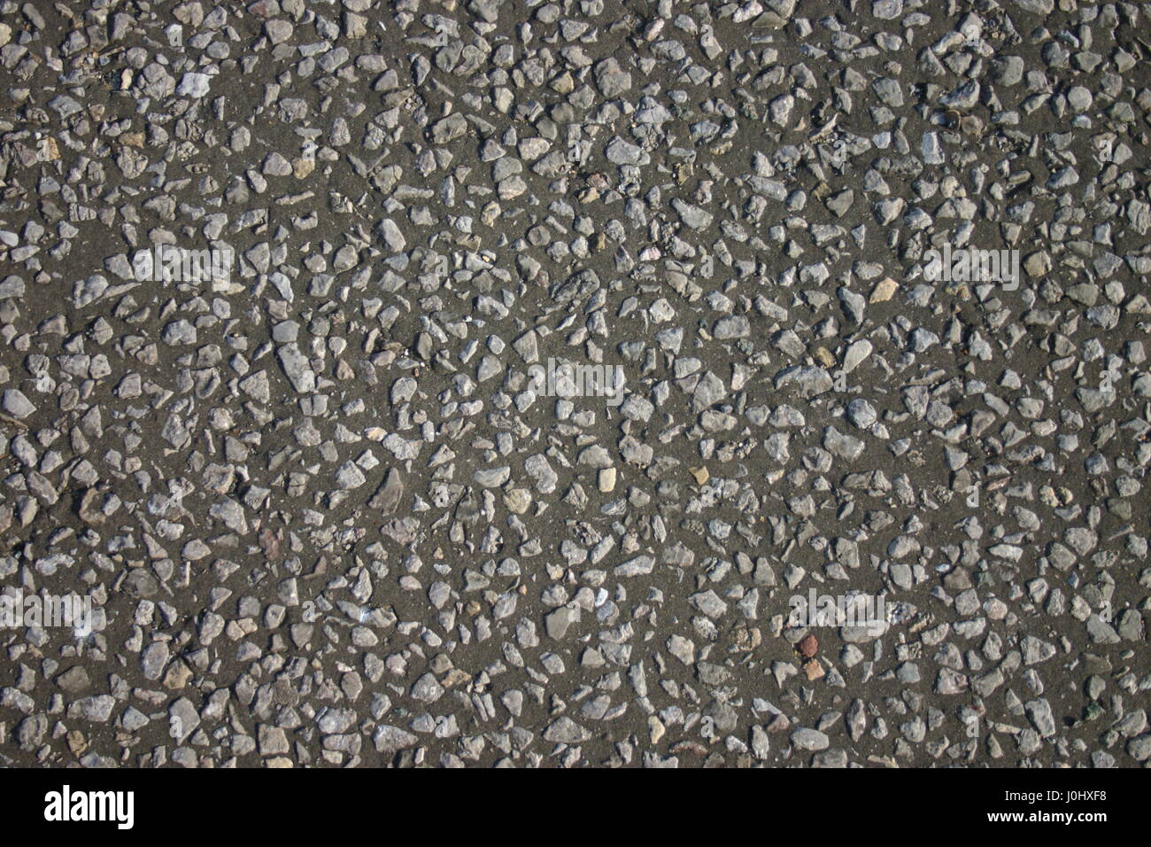 Gritted road surface, tarmac or asphalt as a background Stock Photo - Alamy