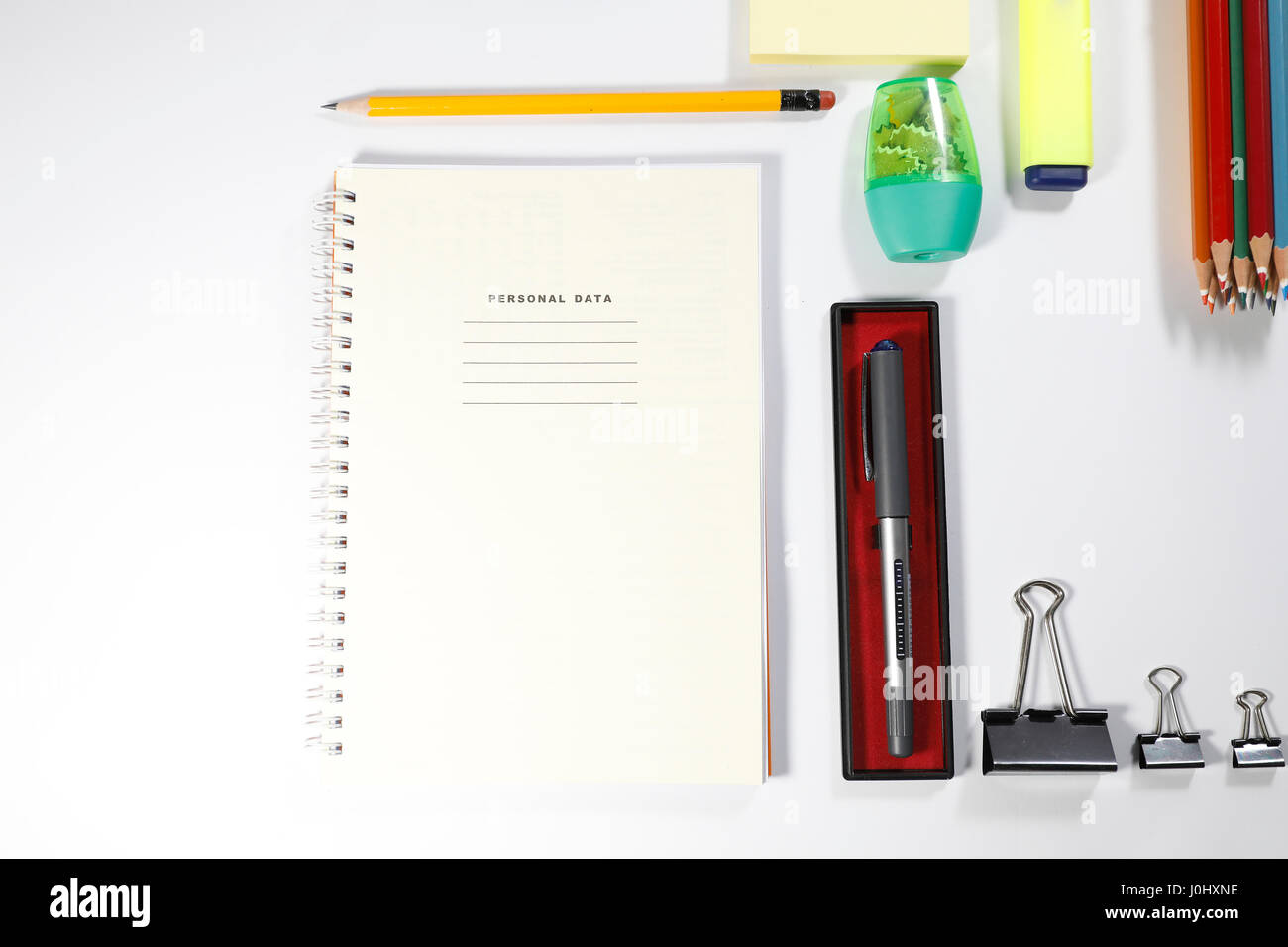 Notebook, color pencils, highlighter, memory note, pencil, binder clip ...