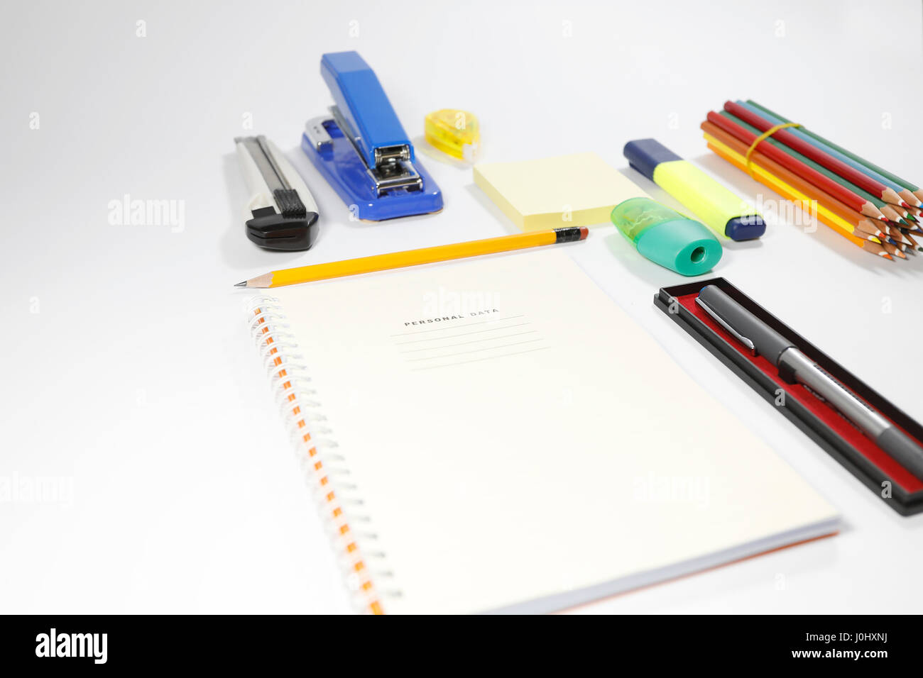 Notebook, color pencils, highlighter, memory note, pencil, binder clip ...