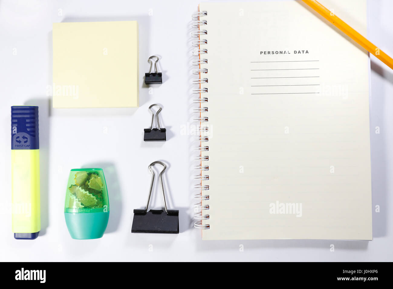 Notebook, color pencils, highlighter, memory note, pencil, binder clip ...