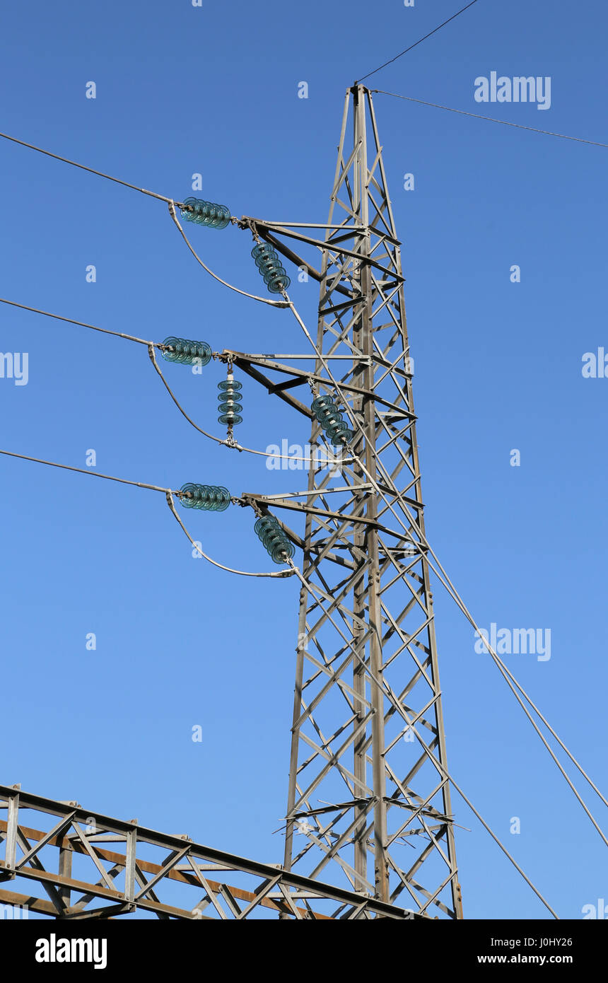 high voltage pylon and the power line near the electrical substation ...