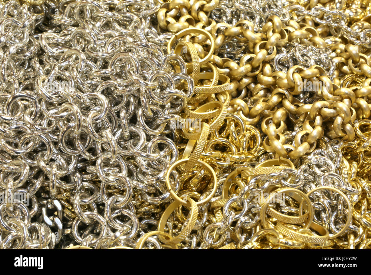background of many chains in gold and silver material Stock Photo - Alamy