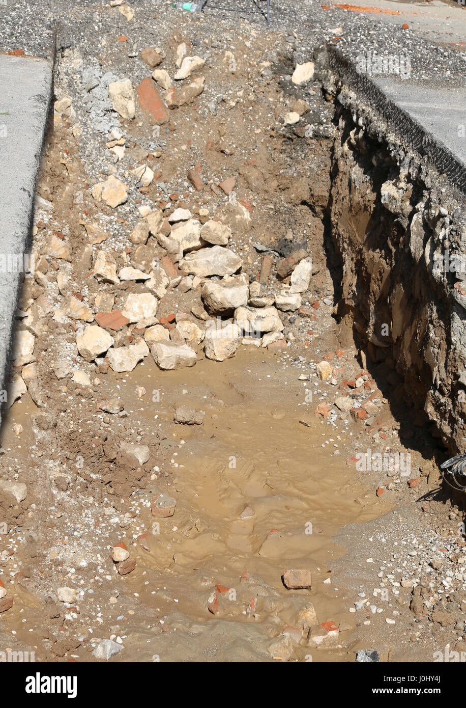 big trench in the construction site with many stones Stock Photo - Alamy