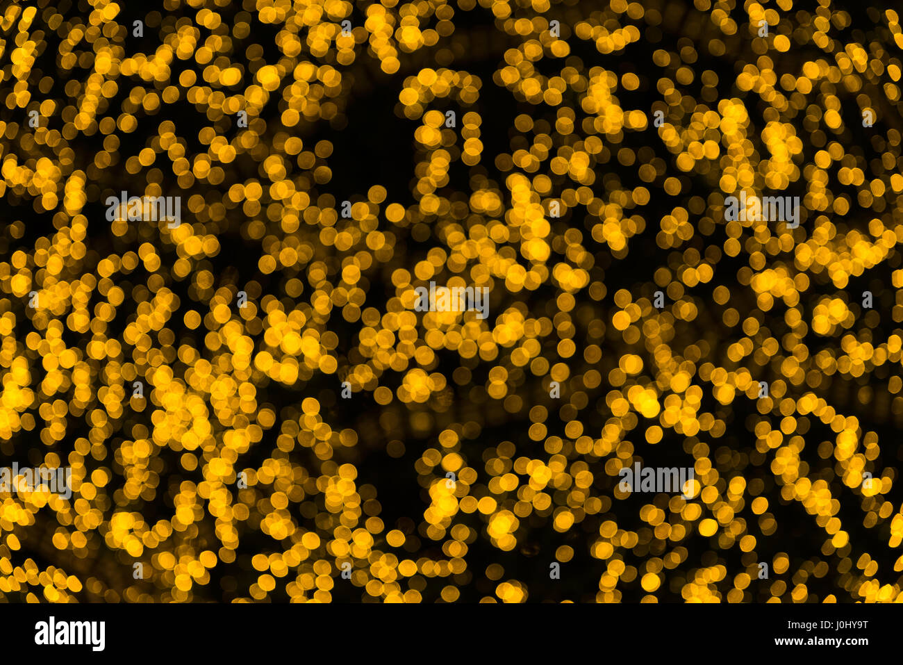Yellow Bokeh on black background Stock Photo - Alamy