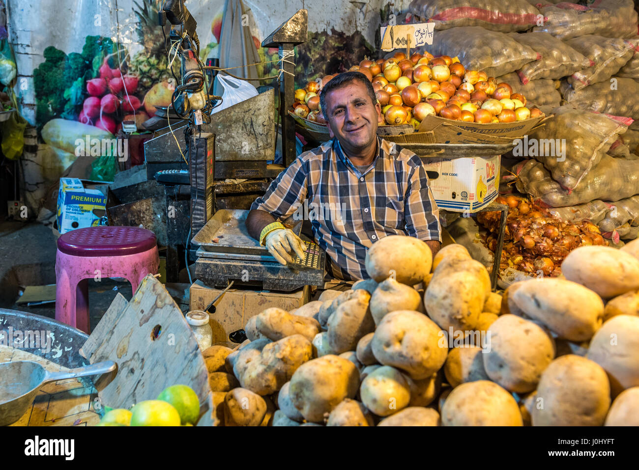 Iranian men selling vegetables on small market place in Shiraz city ...