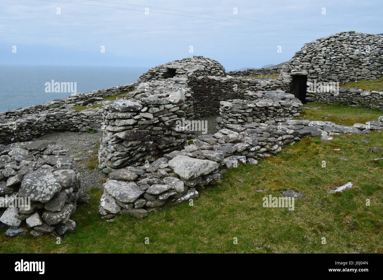 Large collection of intact beehive huts in Ireland Stock Photo - Alamy