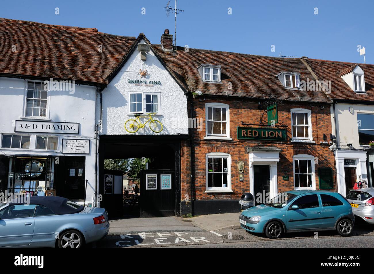 Red Lion, High Street, Stevenage, Hertfordshire, has a bicycle mounted ...
