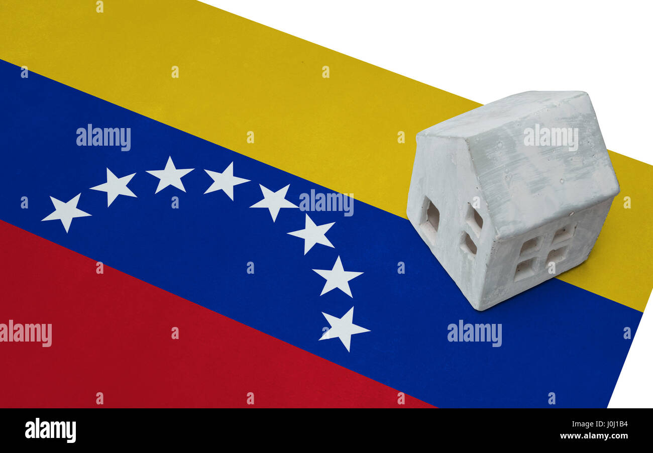 Small house on a flag - Living or migrating to Venezuela Stock Photo ...