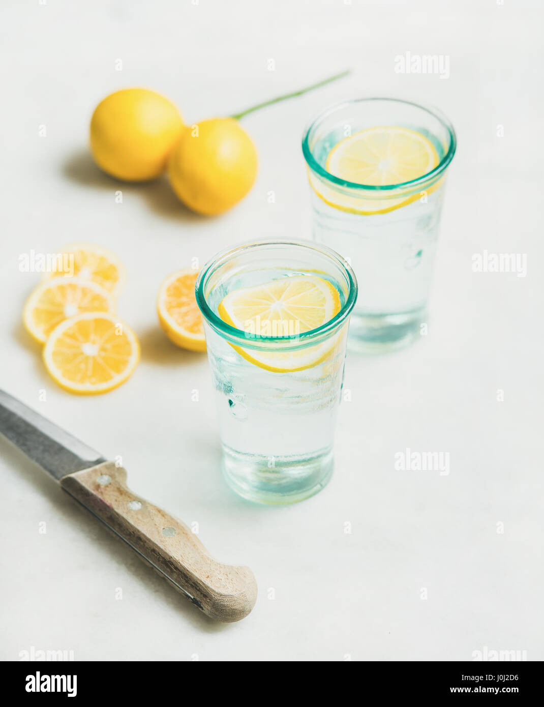 Morning detox lemon water in glasses and fresh lemons Stock Photo - Alamy